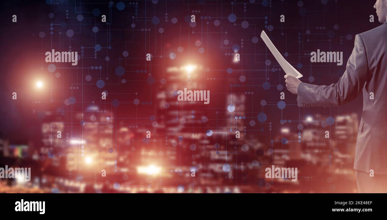 Businessman against night cityscape hi-res stock photography and images ...