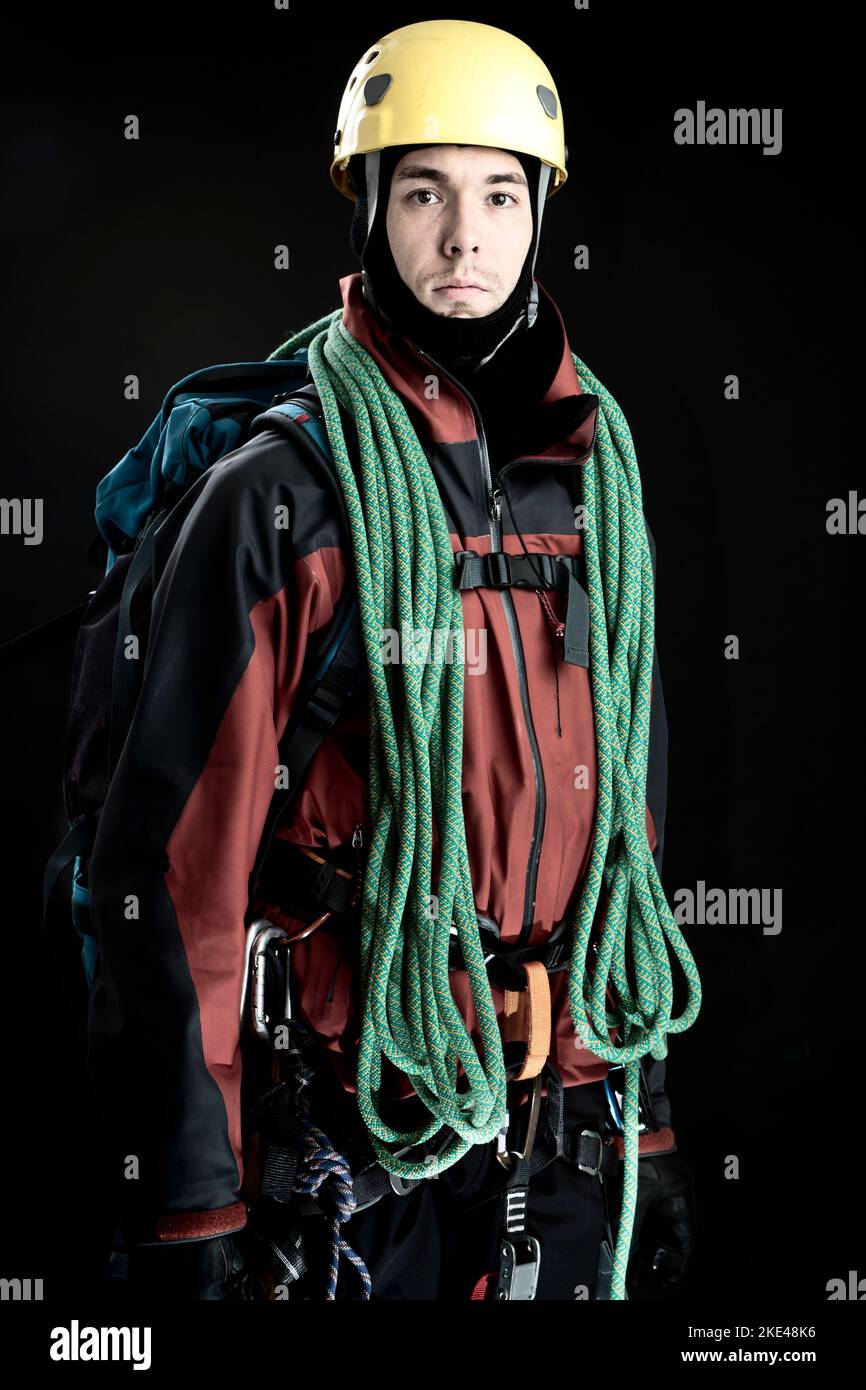 Studio portrait of a mountaineer with rope and ice climbing gear Stock ...