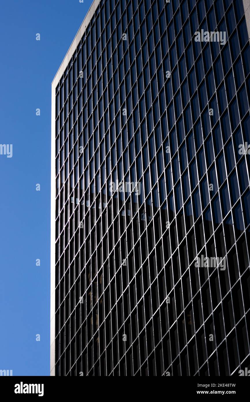 A vertical shot of multi-story office building's facade Stock Photo - Alamy
