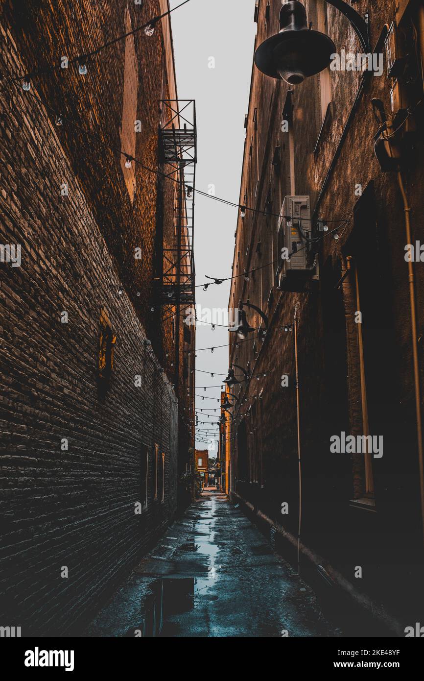 A vertical shot of the narrow pathway between the buildings Stock Photo ...