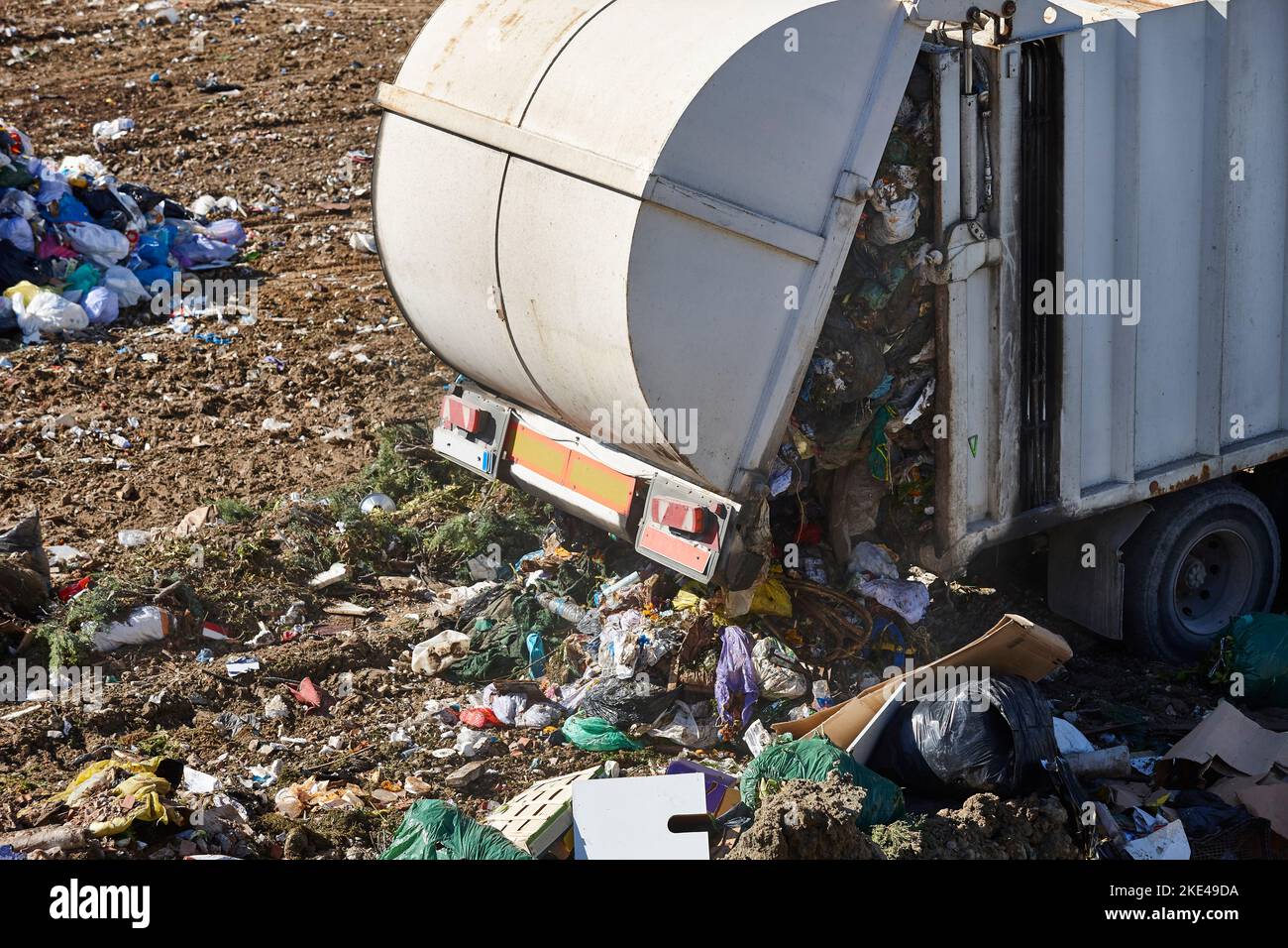 Truck unloading garbage on an open air dump. Waste recycling Stock Photo - Alamy