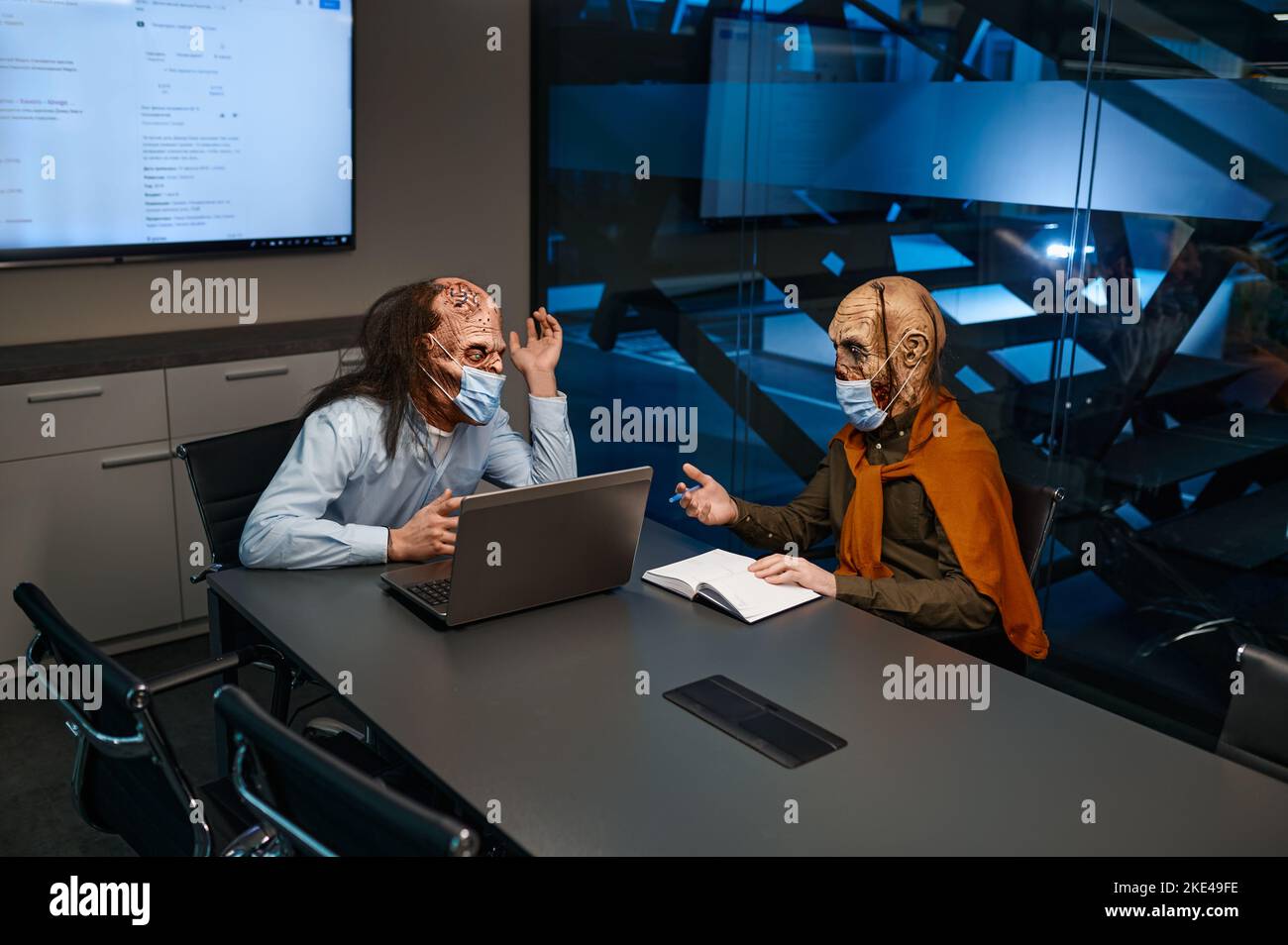 Zombie businessmen in face mask working at meeting room Stock Photo - Alamy