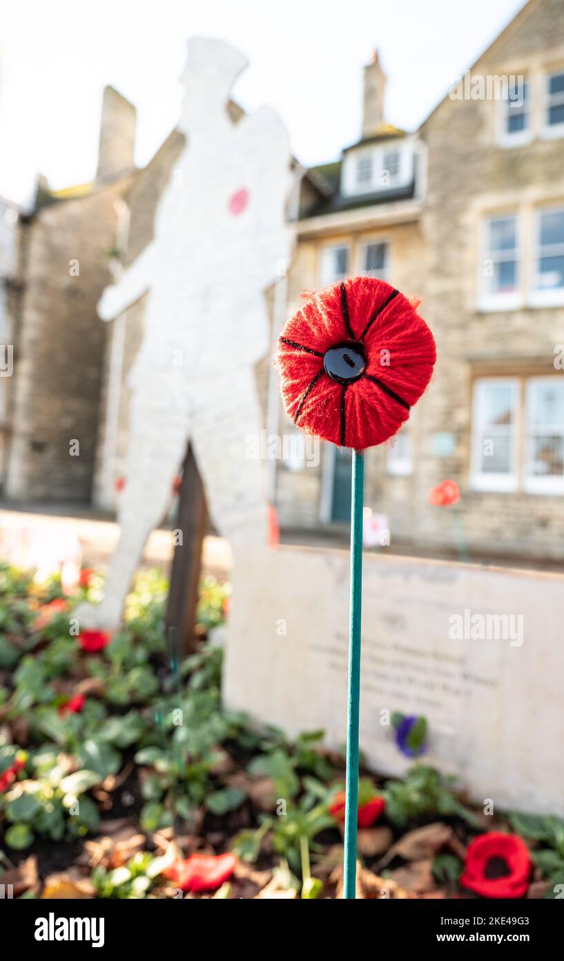Ceramic poppies pushed into the soil in the graveyard at St Mary's ...