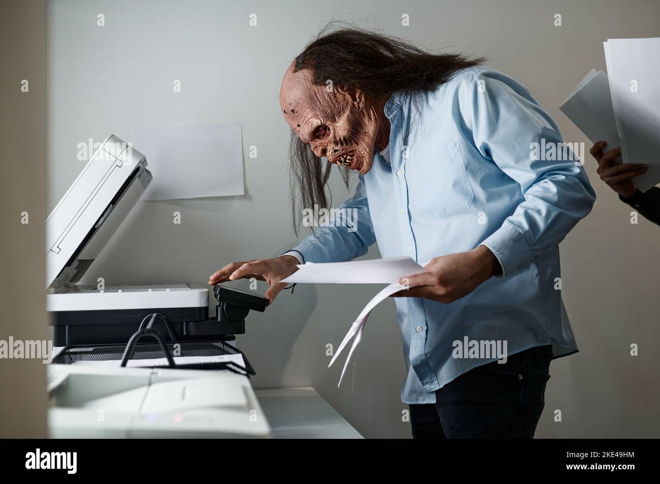 Zombie at copier in the office Stock Photo - Alamy