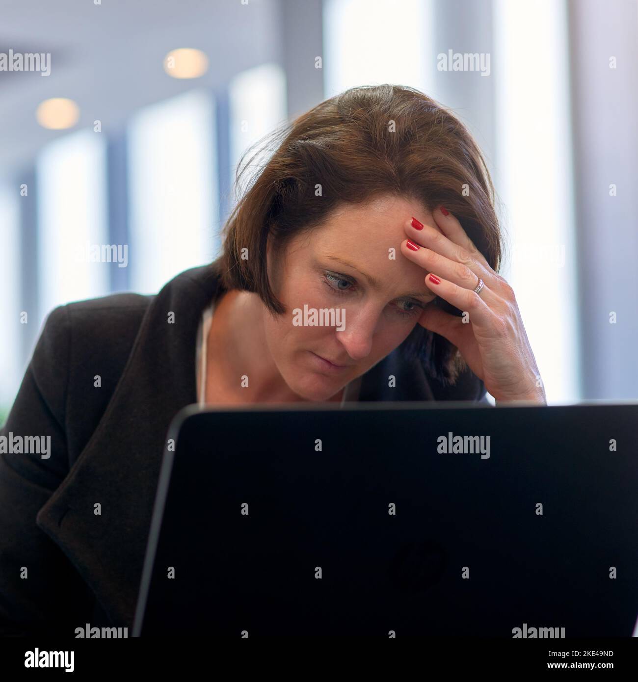 That deadline keeps creeping closer. a stressed businesswoman looking ...
