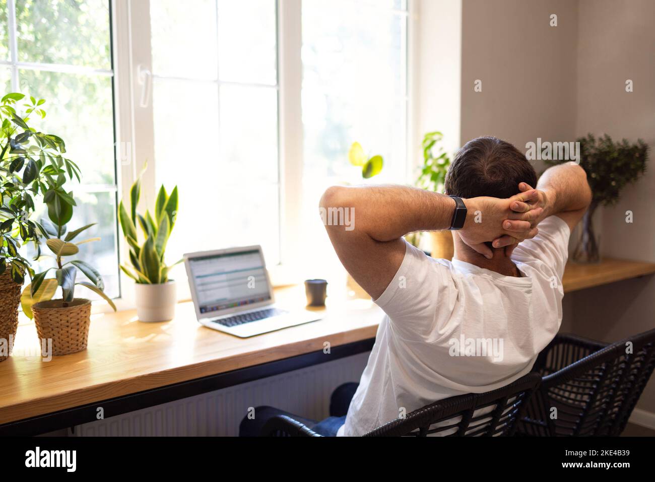 Young personal development coach answering the client by email by a ...