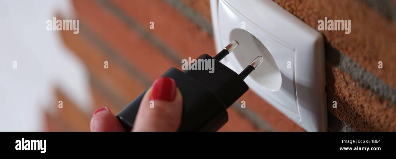 Hand inserting electrical plug hi-res stock photography and images - Alamy