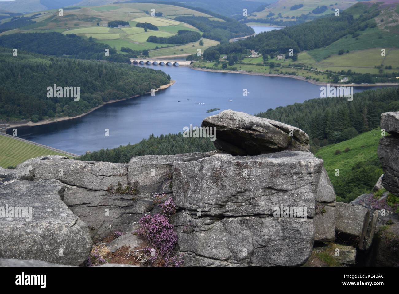 A rocky cliff overlooking the wide river and trees Stock Photo - Alamy