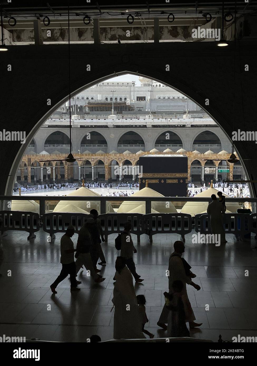 A group of Muslims pursuing umrah or Pilgrimage and the Kaaba on the ...