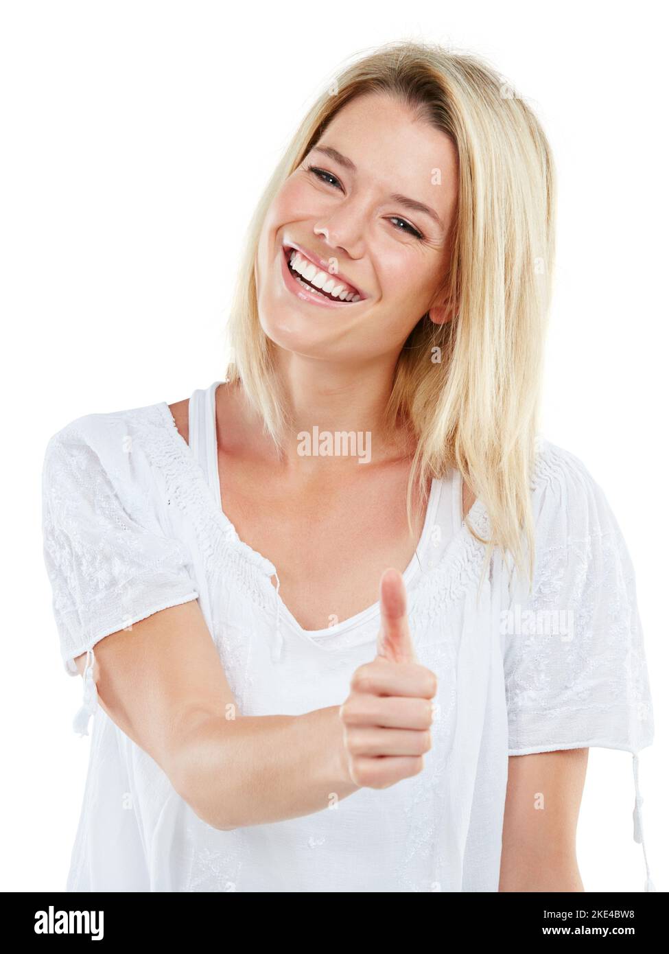 Good on ya. Studio portrait of an attractive young woman giving thumbs ...