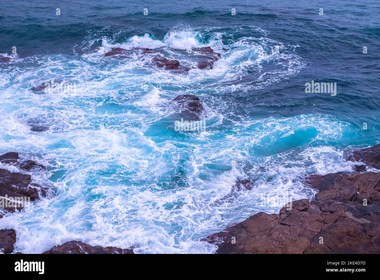 Water of the Atlantic Ocean breaking over rocks - water breaking on ...