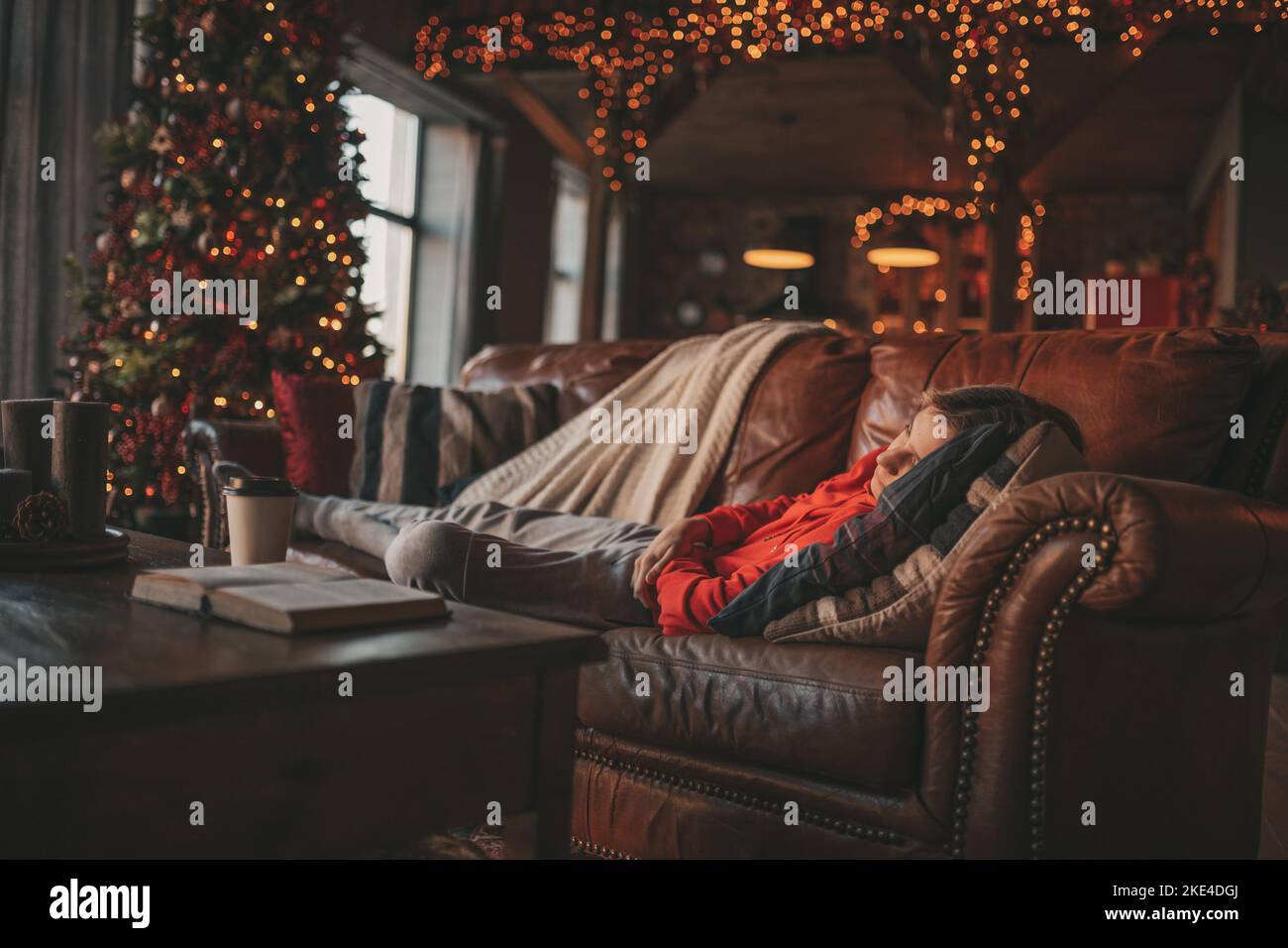 Young teen boy with long hair thoughtful look sad eyes negative mood ...