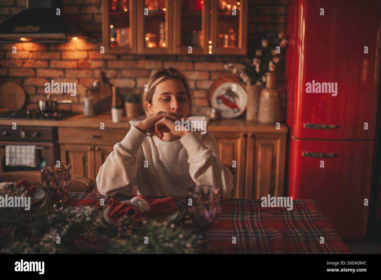 Young teen boy with long hair thoughtful look sad eyes negative mood ...