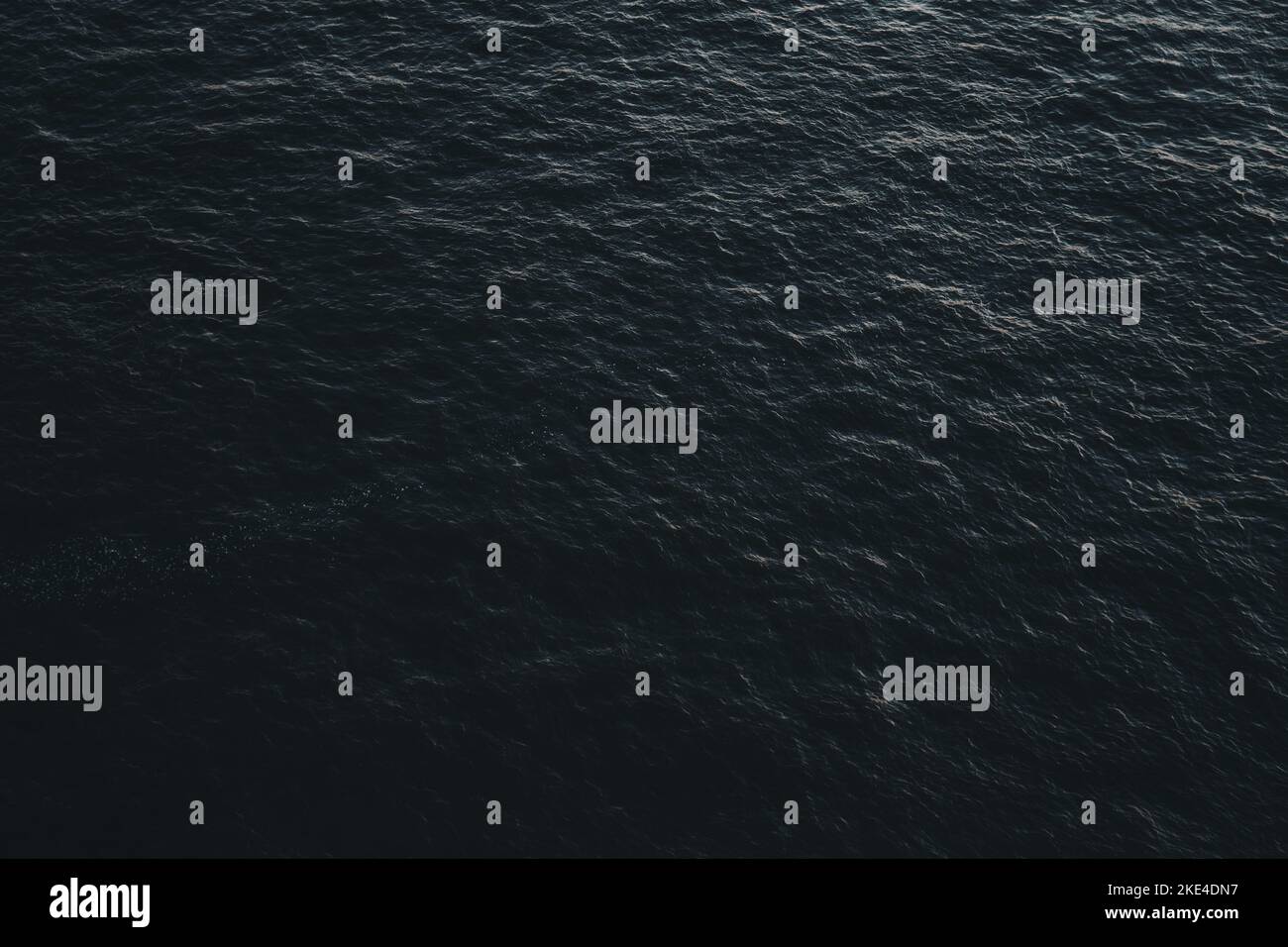 A top view of the water surface of the sea in the dark Stock Photo - Alamy