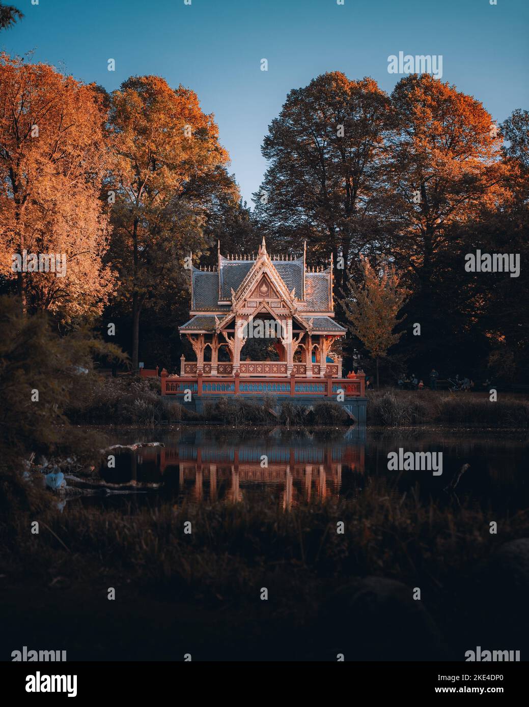 A vertical shot of a beautiful neo-gothic mansion at the pond Stock ...