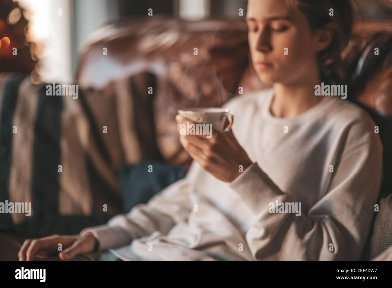 Young teen boy with long hair thoughtful look sad eyes negative mood ...