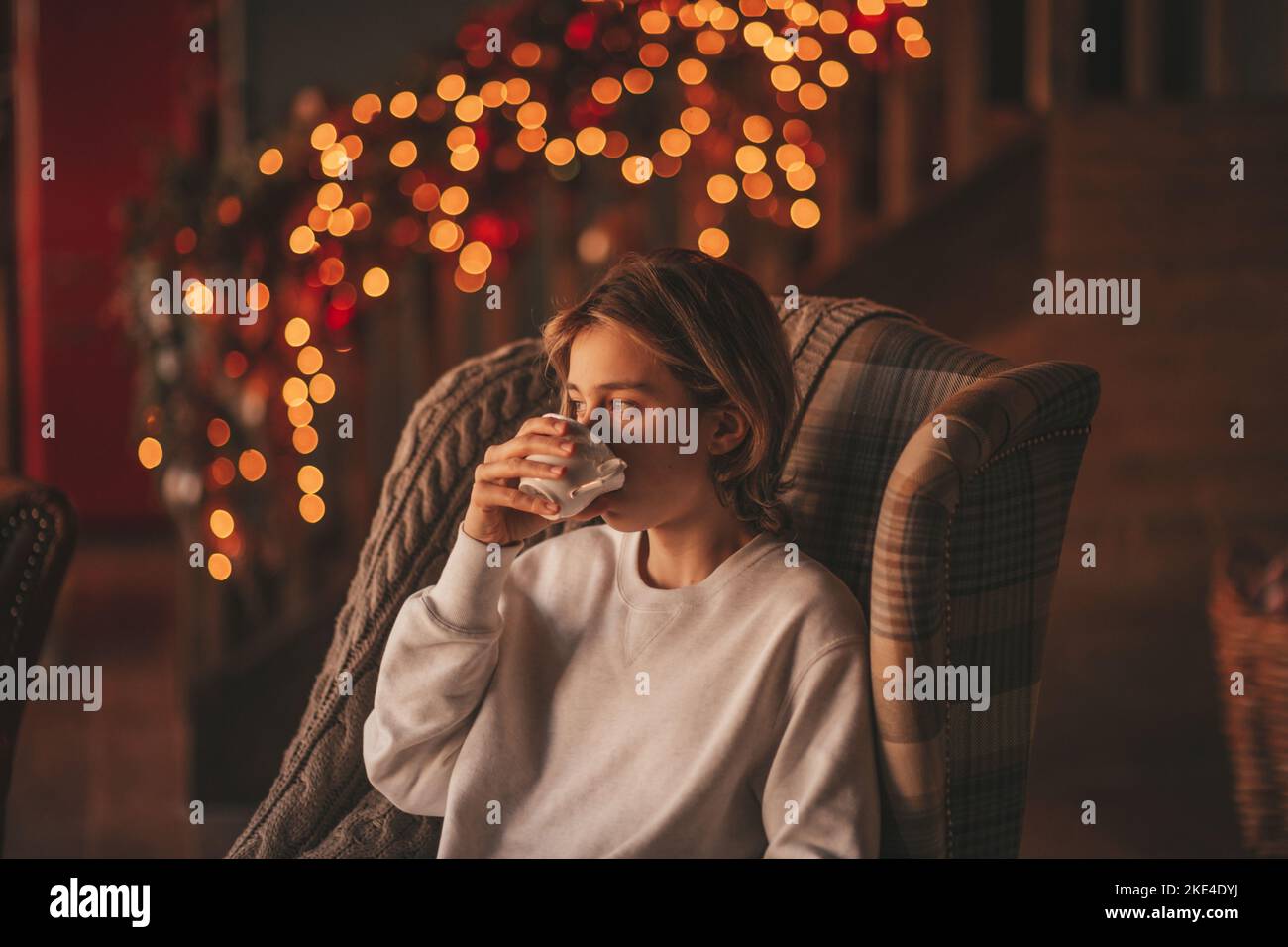 Young teen boy with long hair thoughtful look sad eyes negative mood ...