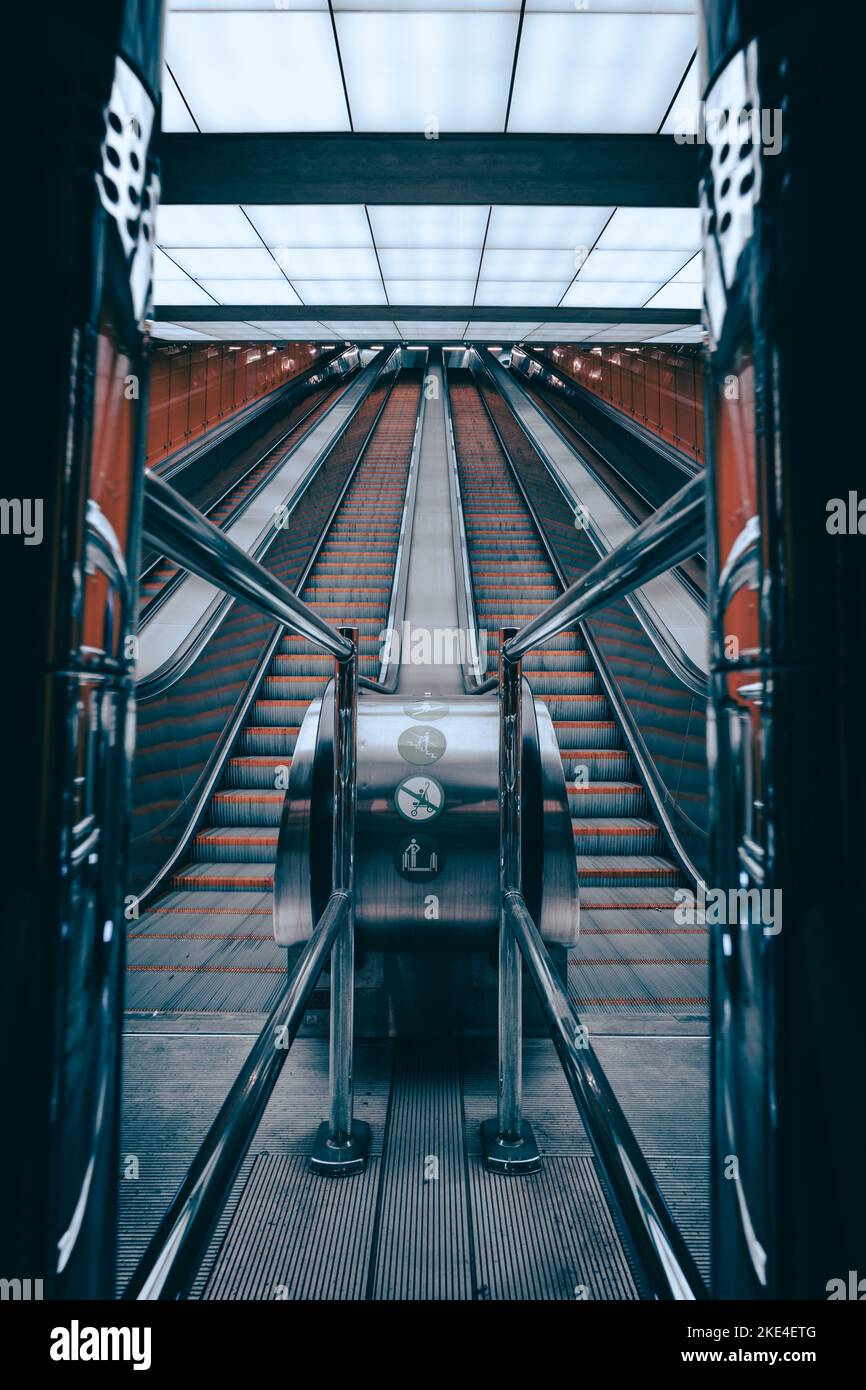 A dramatic vertical view of the moving staircase in the underground ...