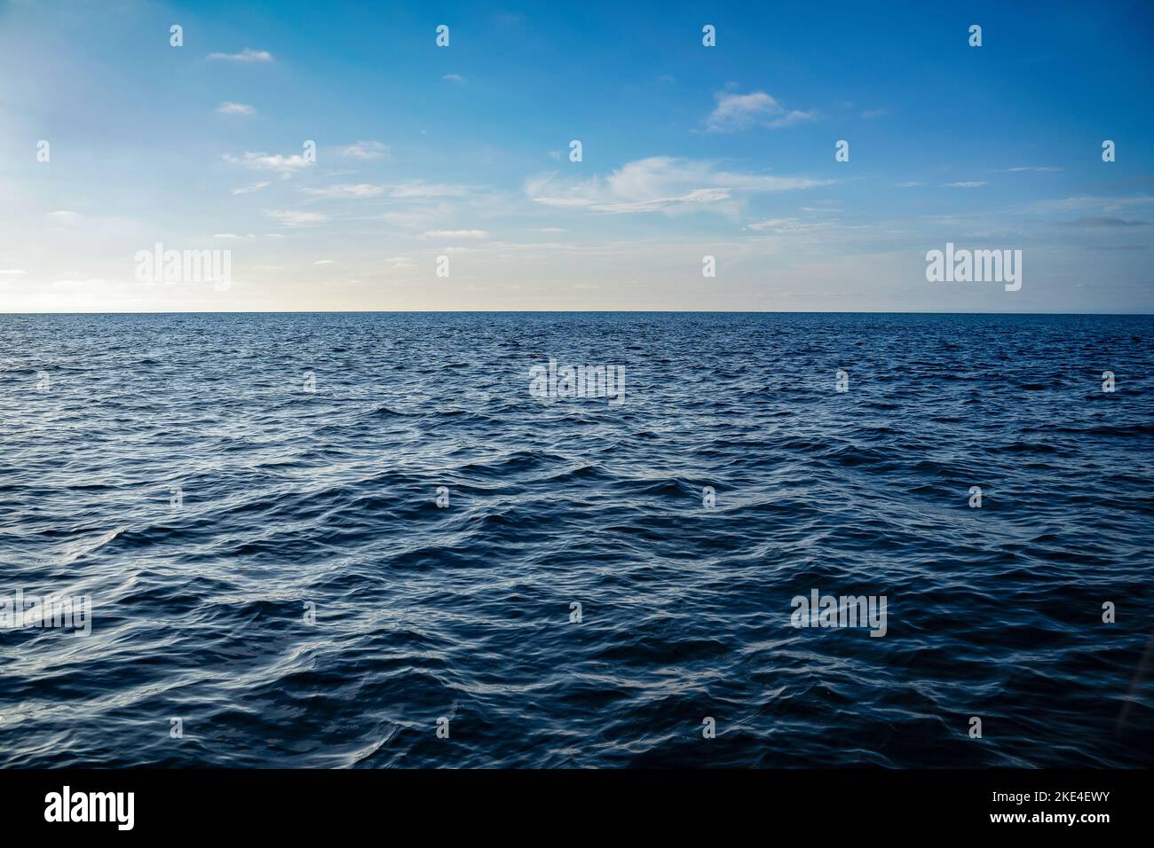 Bright blue Ocean water ripples background on a sunny day. Clean water ...