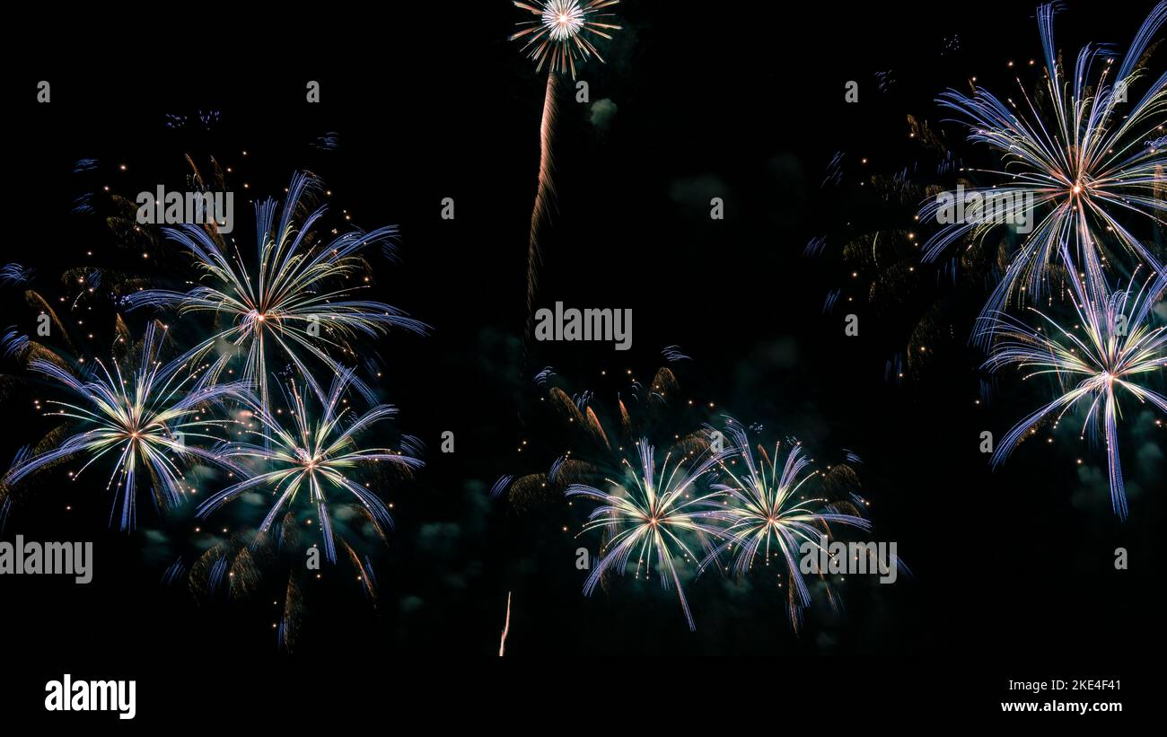 A scenic shot of the colorful fireworks against the night sky ...
