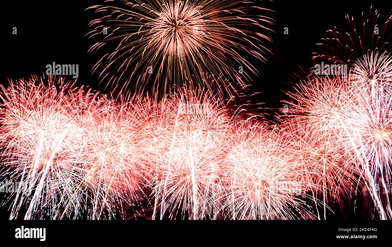 A scenic shot of the red fireworks against the night sky background ...