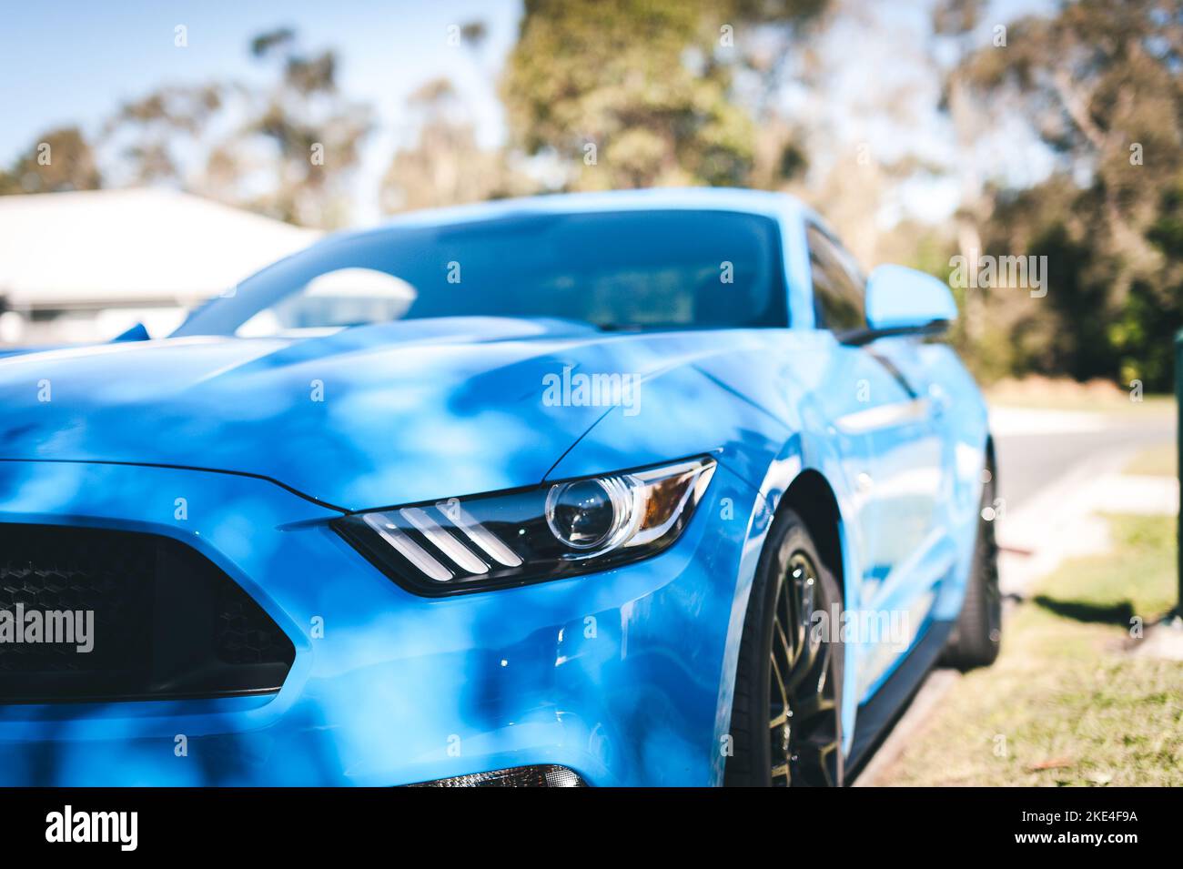 A blue Ford Mustang front headlight Stock Photo - Alamy
