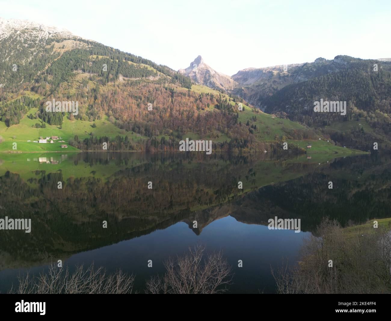 A beautiful shot of a lake reflecting the surrounded landscape Stock ...