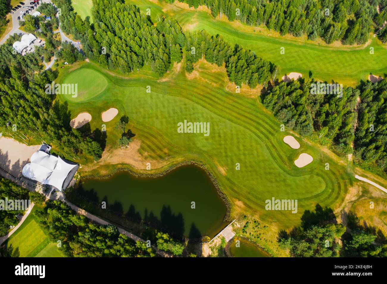 Top view of the golf course located in a wooded area Stock Photo - Alamy