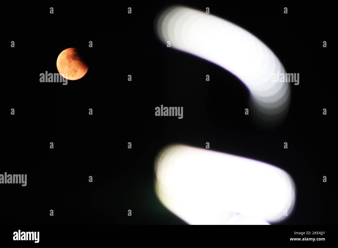 Kolkata, West Bengal, India. 8th Nov, 2022. The 'Blood Moon' is seen ...