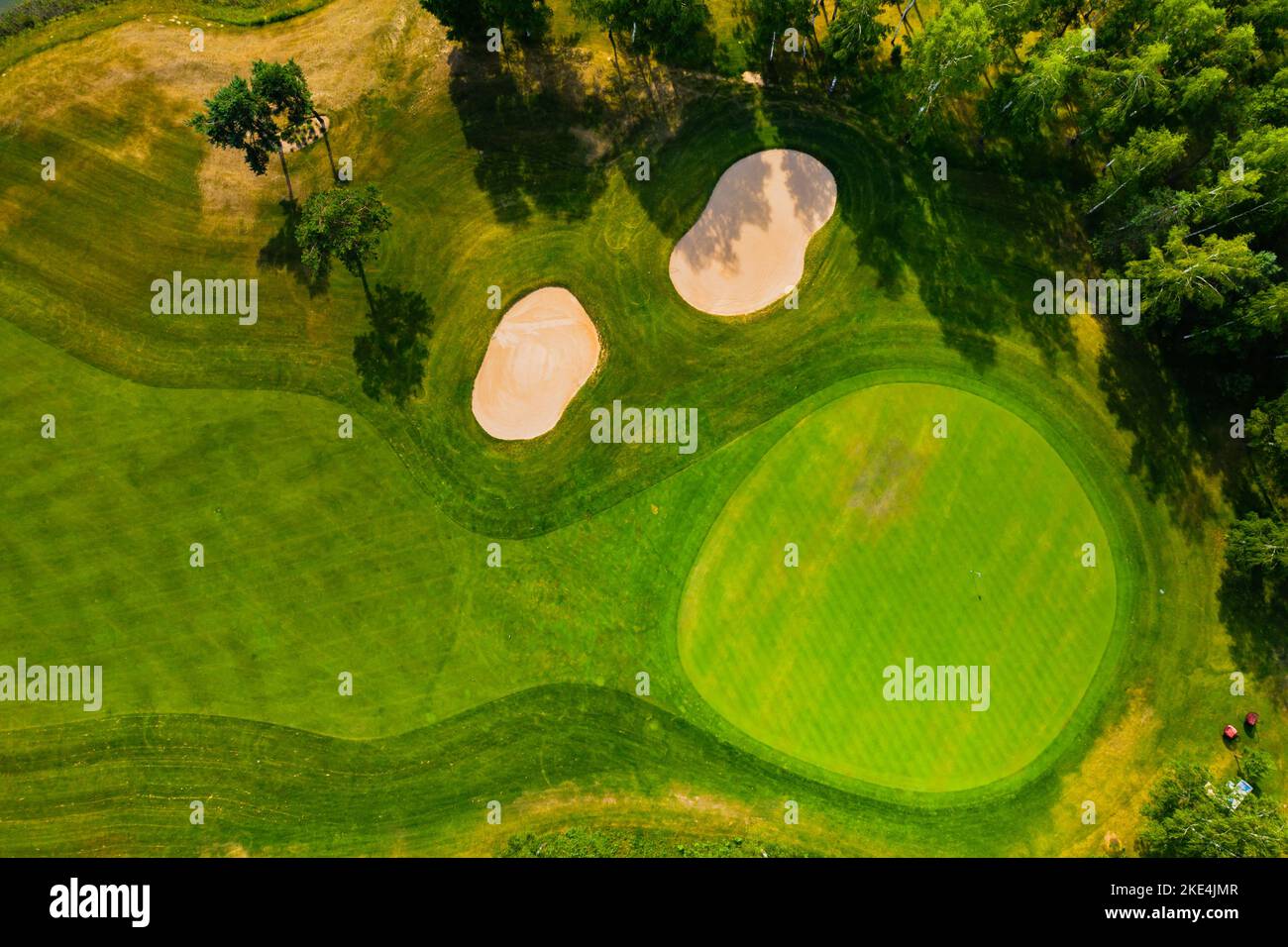 Top view of the golf course located in a wooded area Stock Photo - Alamy