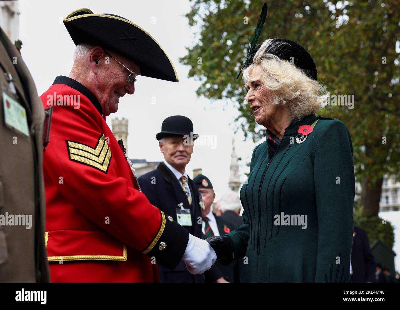 The Queen Consort, Patron of the Poppy Factory, greets a Chelsea ...