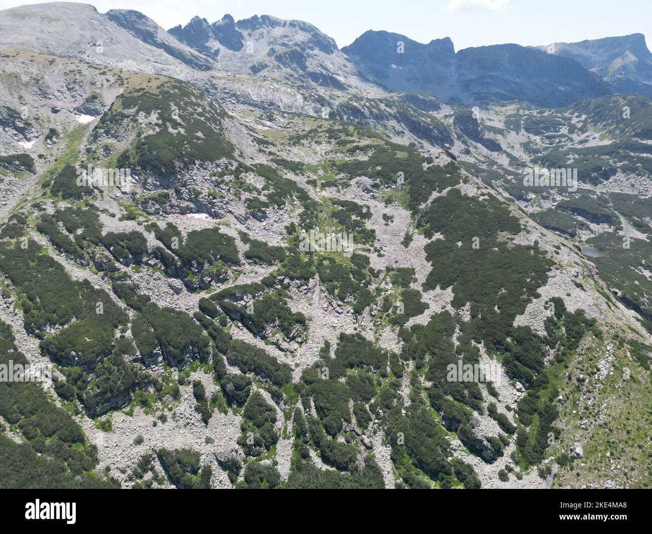 An aerial view of mountains covered in greenery in the Dinaric Alps ...