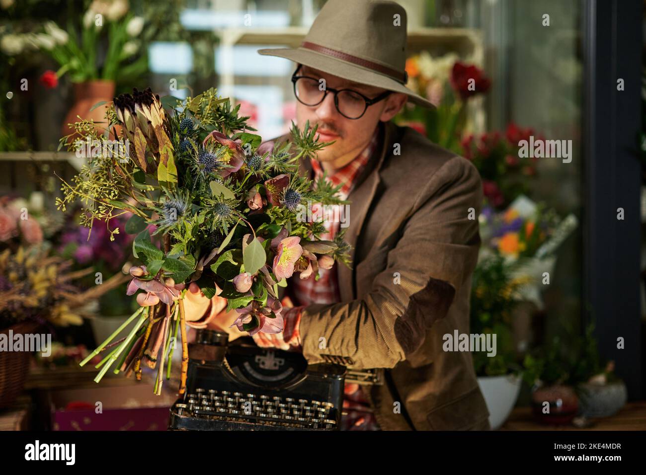 Cute retro styled caucasian male person in eyeglasses and hat sitting ...