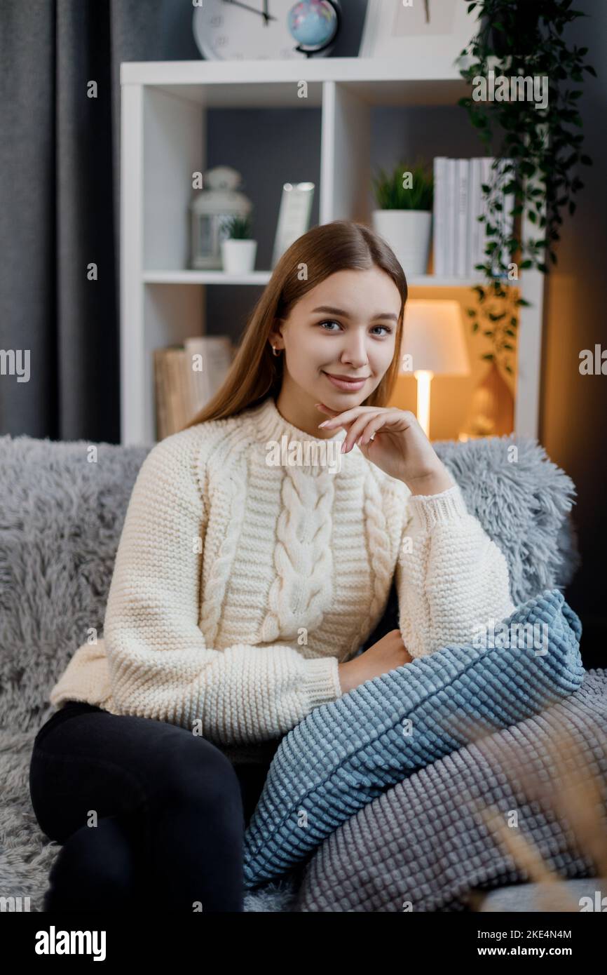 Woman resting on couch Stock Photo - Alamy