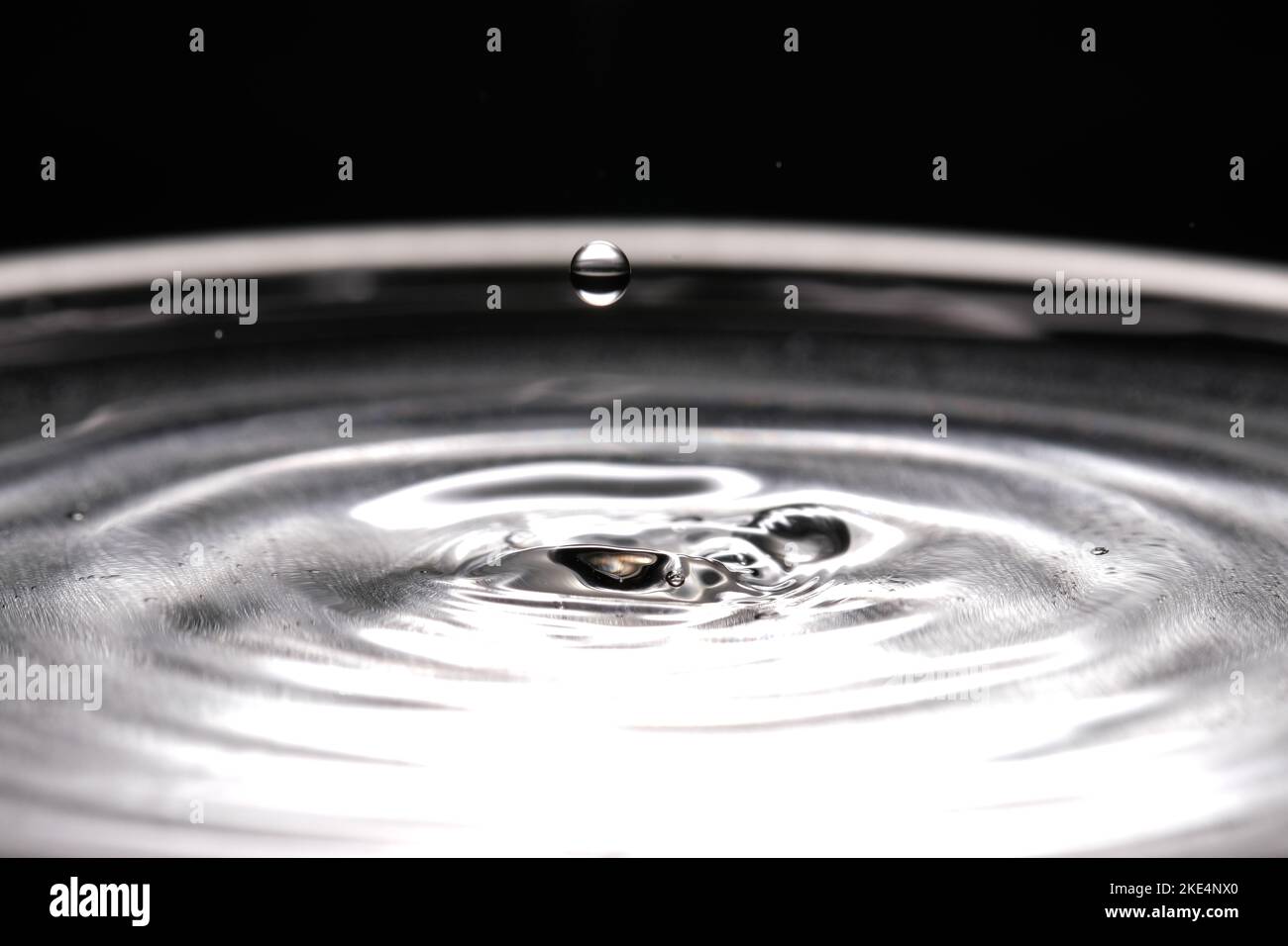 A Macro shot of splashing water drop, grayscale shot Stock Photo - Alamy
