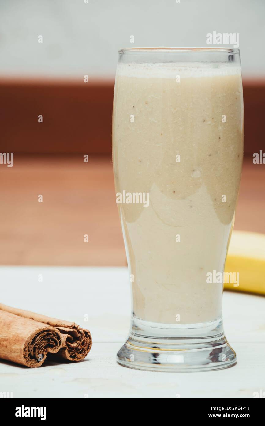 A closeup of a glass of coffee with a cinnamon Stock Photo - Alamy