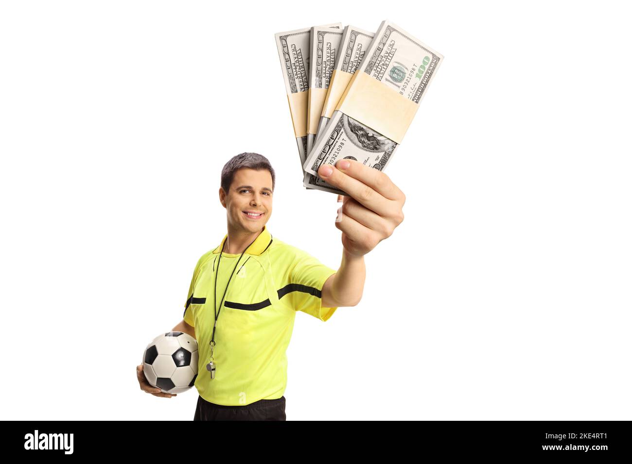 Football referee holding a ball and money isolated on white background ...