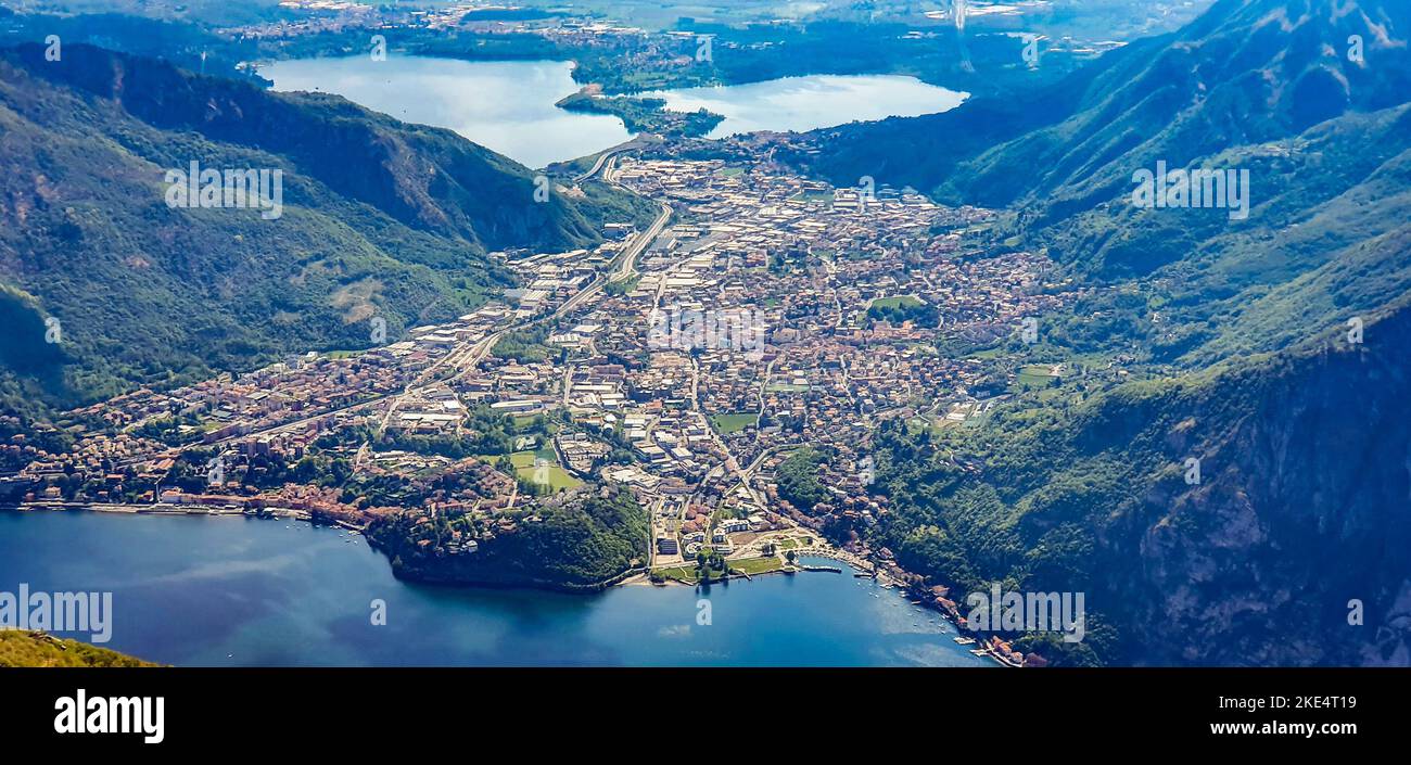 An aerial view of the riverside city surrounded by rocks Stock Photo ...