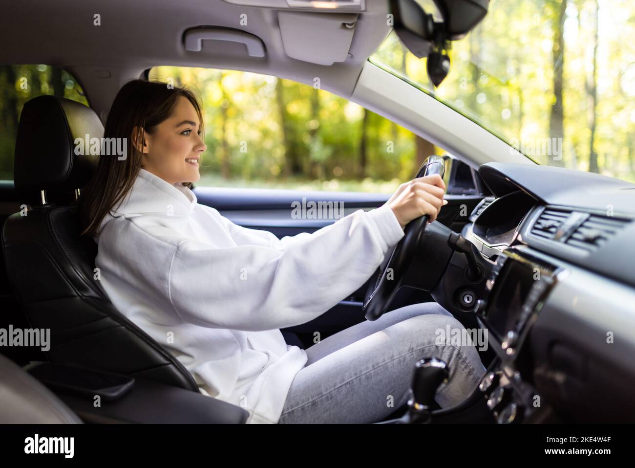 Young woman driving her car Stock Photo - Alamy