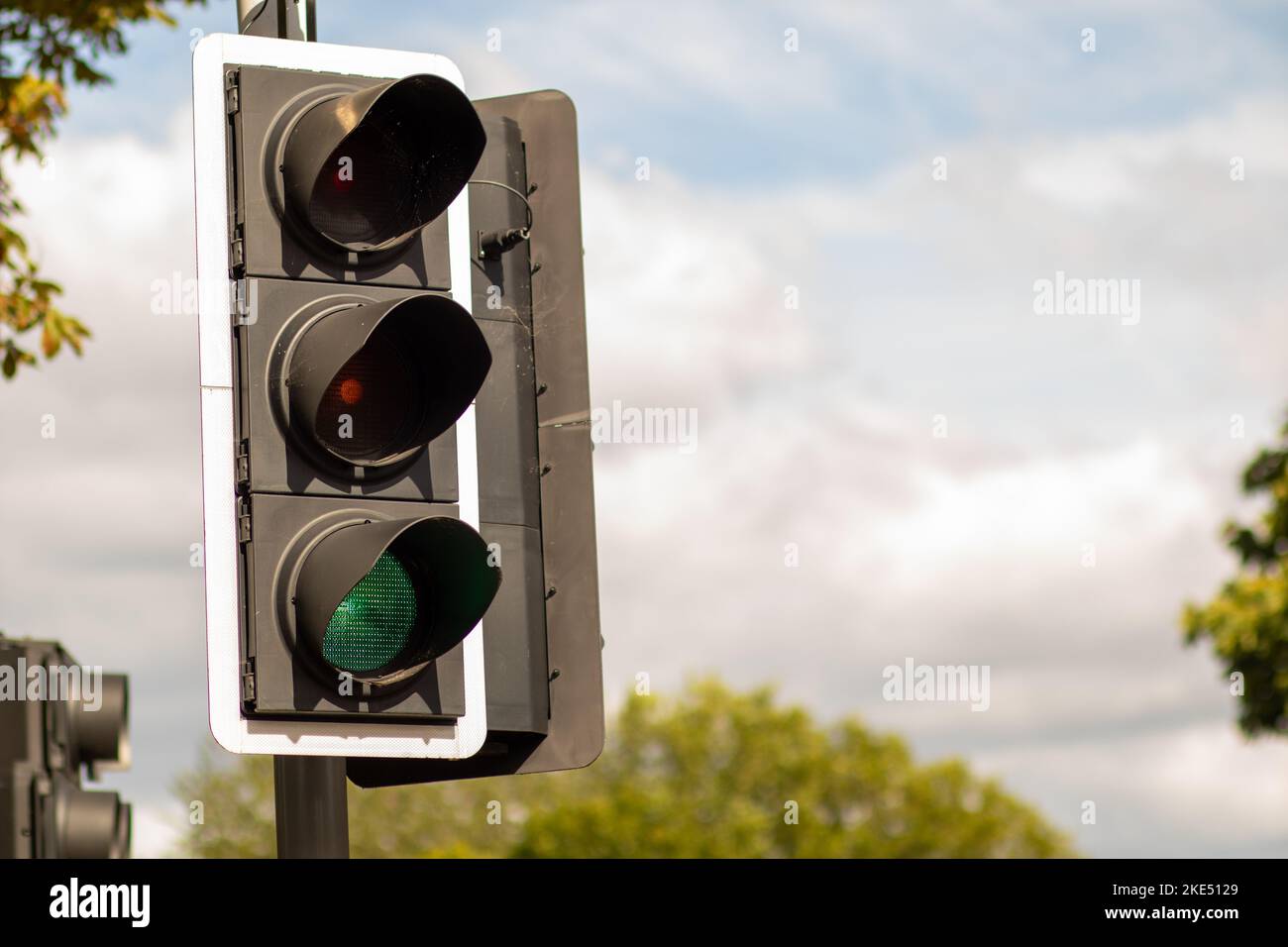 A closeup of traffic light post showing green Stock Photo - Alamy
