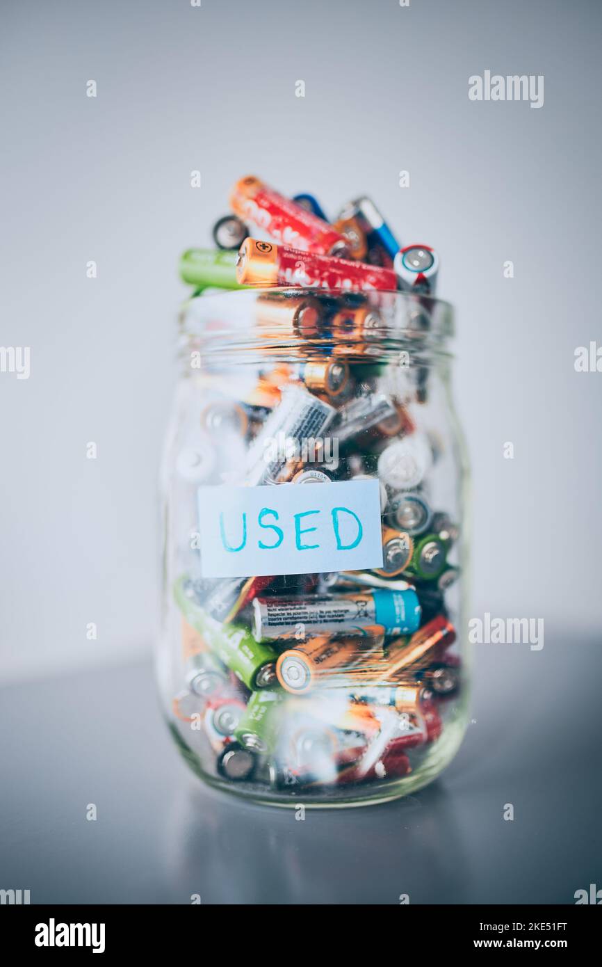 Jar filled with discharged used batteries. Waste disposal and recycling ...