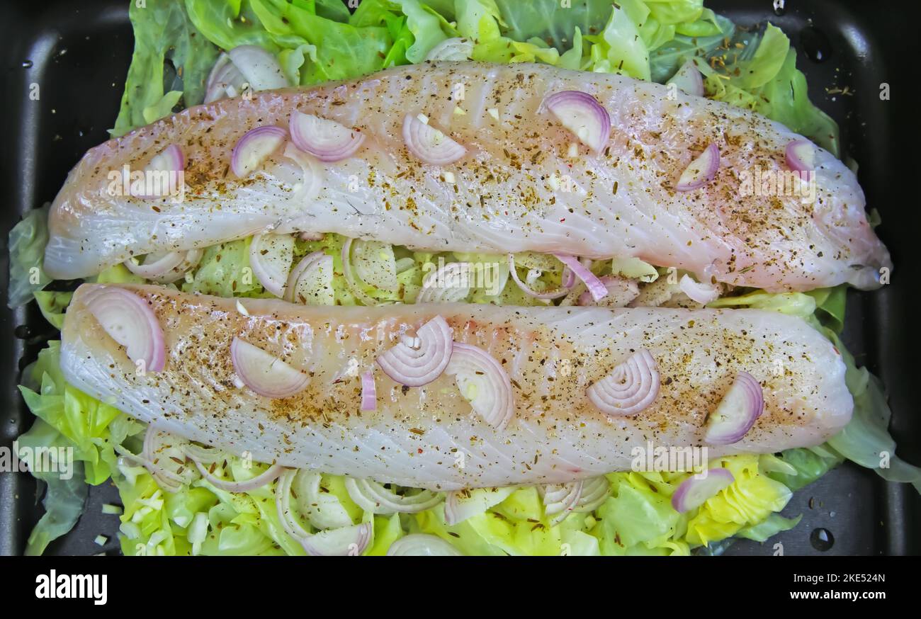 Preparation of fish meal: Isolated oven tray with 2 fresh raw codfish ...