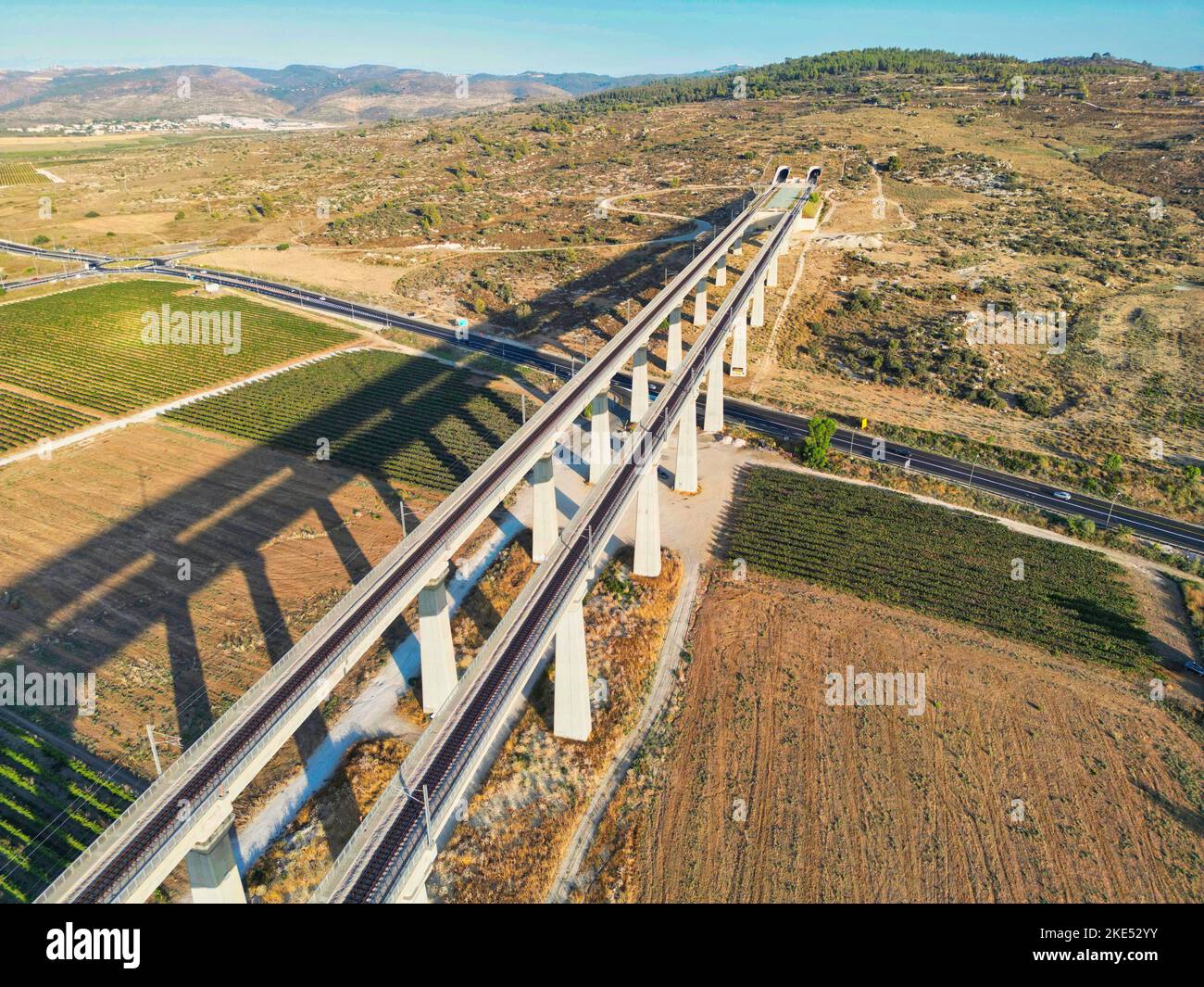 Aerial view of a two way trains bridges with a tunnel at a distance ...