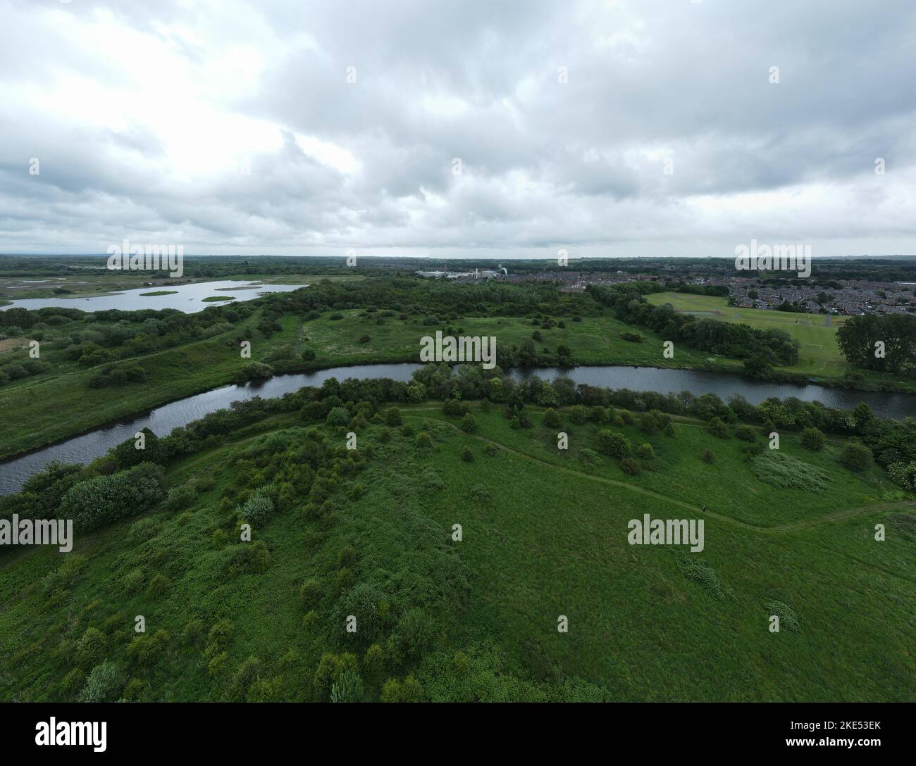 An aerial view of a meander in the River Mersey with Woolston Eyes ...