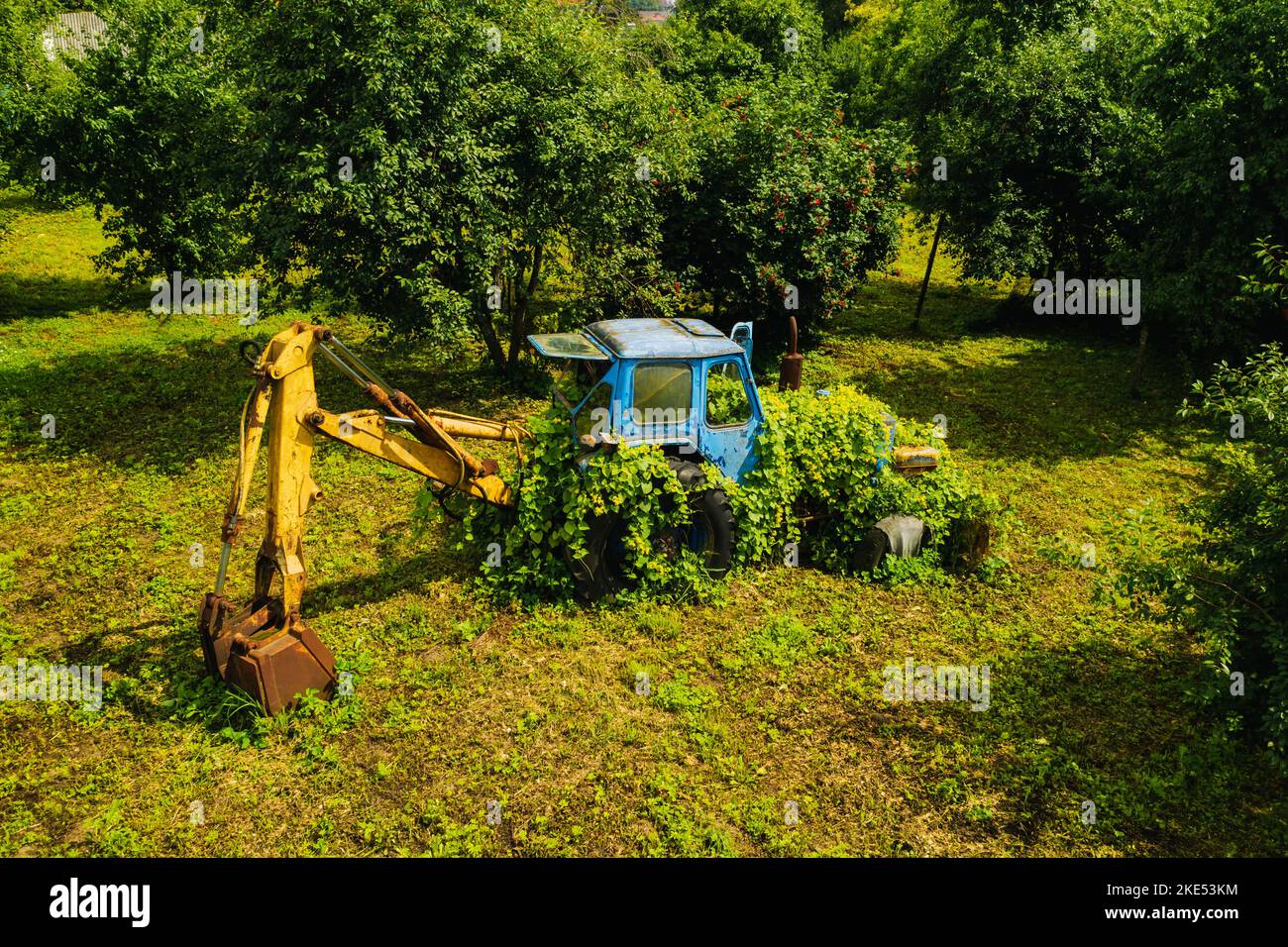 Overgrown old farm equipment hi-res stock photography and images - Alamy