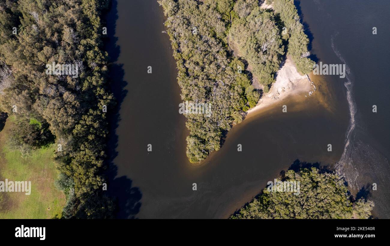 Aerial view of Woronora River surrounded by lush greenery in Sutherland ...