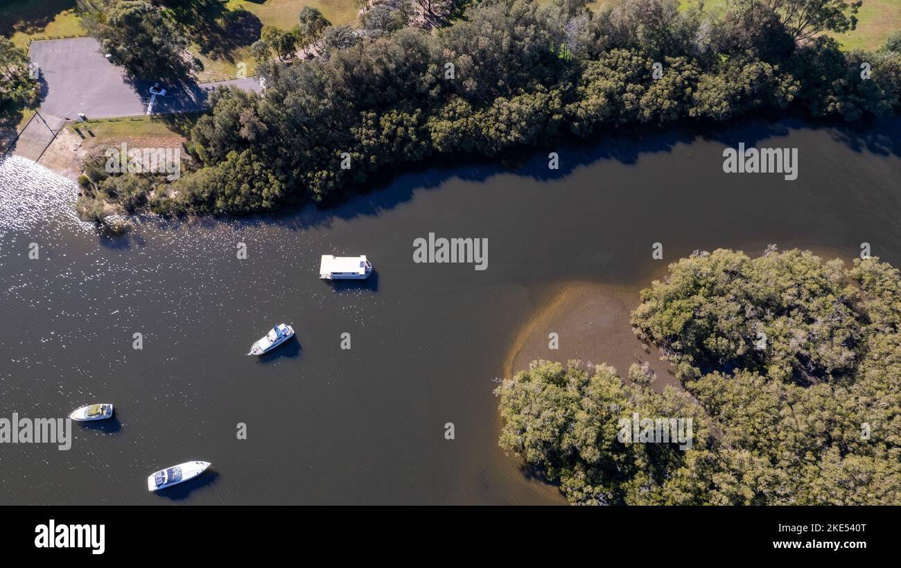 Aerial view of Woronora River surrounded by lush greenery in Sutherland ...