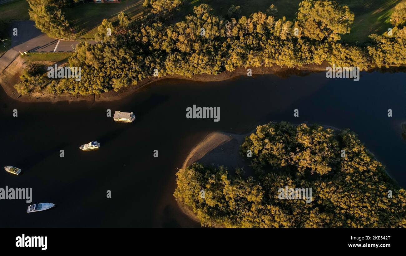 Aerial view of Woronora River surrounded by lush greenery in Sutherland ...