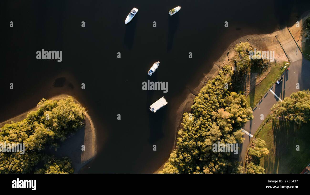 Aerial view of Woronora River surrounded by lush greenery in Sutherland ...