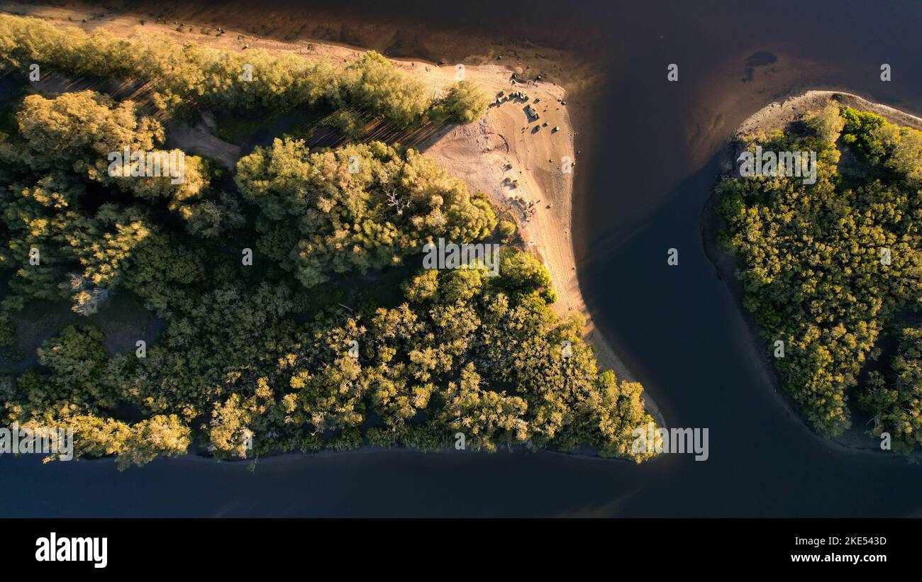 Aerial view of Woronora River surrounded by lush greenery in Sutherland ...